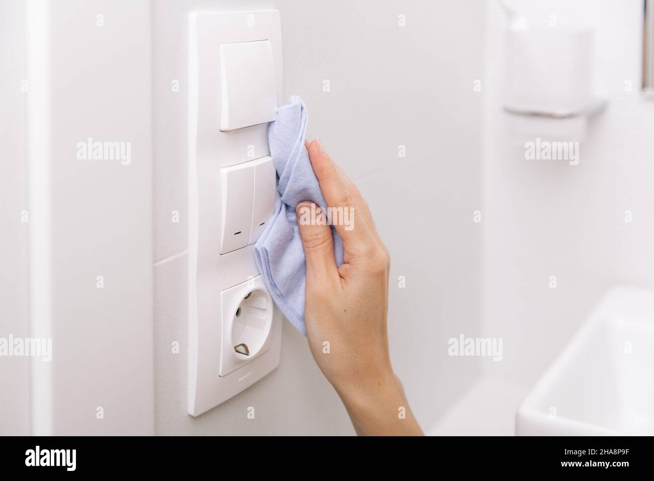 Cleaning switches and sockets with a microfiber cloth. Sanitize ...