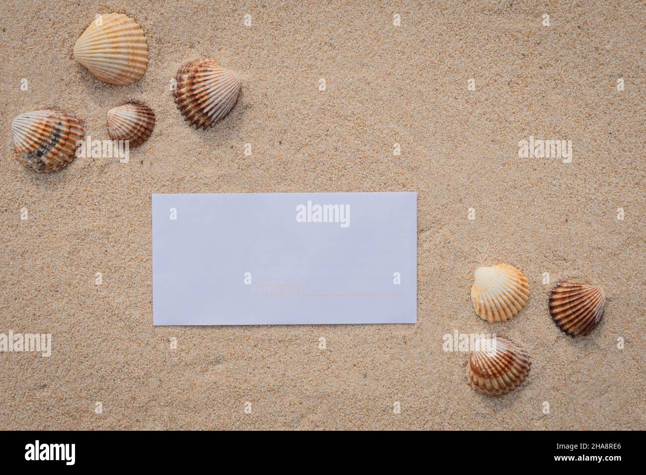 Background grains of sea sand, fine beach sand with envelope and pebble ...