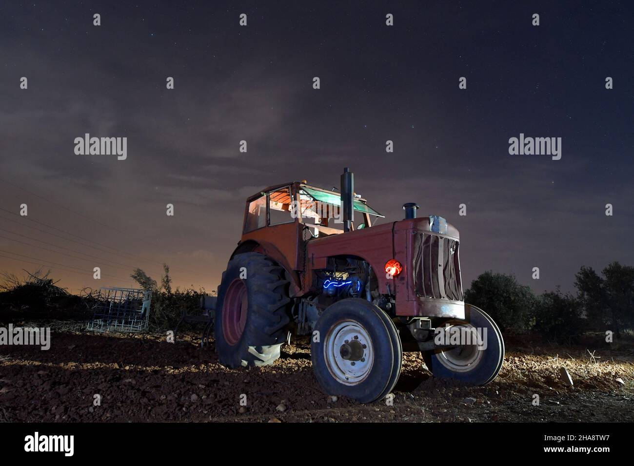 Night photography of an abandoned tractor Stock Photo - Alamy