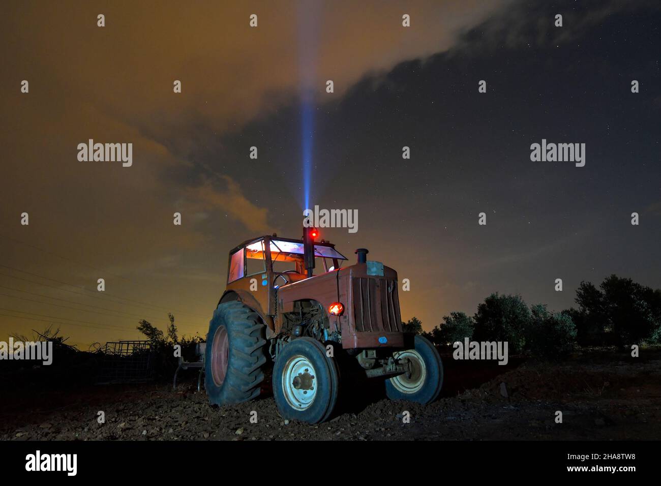 Night photography of an abandoned tractor Stock Photo - Alamy