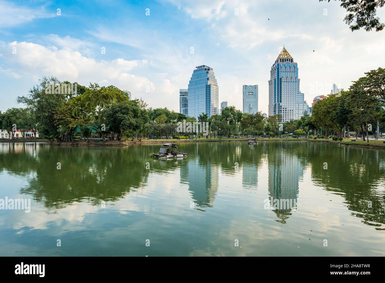 Lumpini park in Bangkok and the skyline of downtown Bangkok central ...