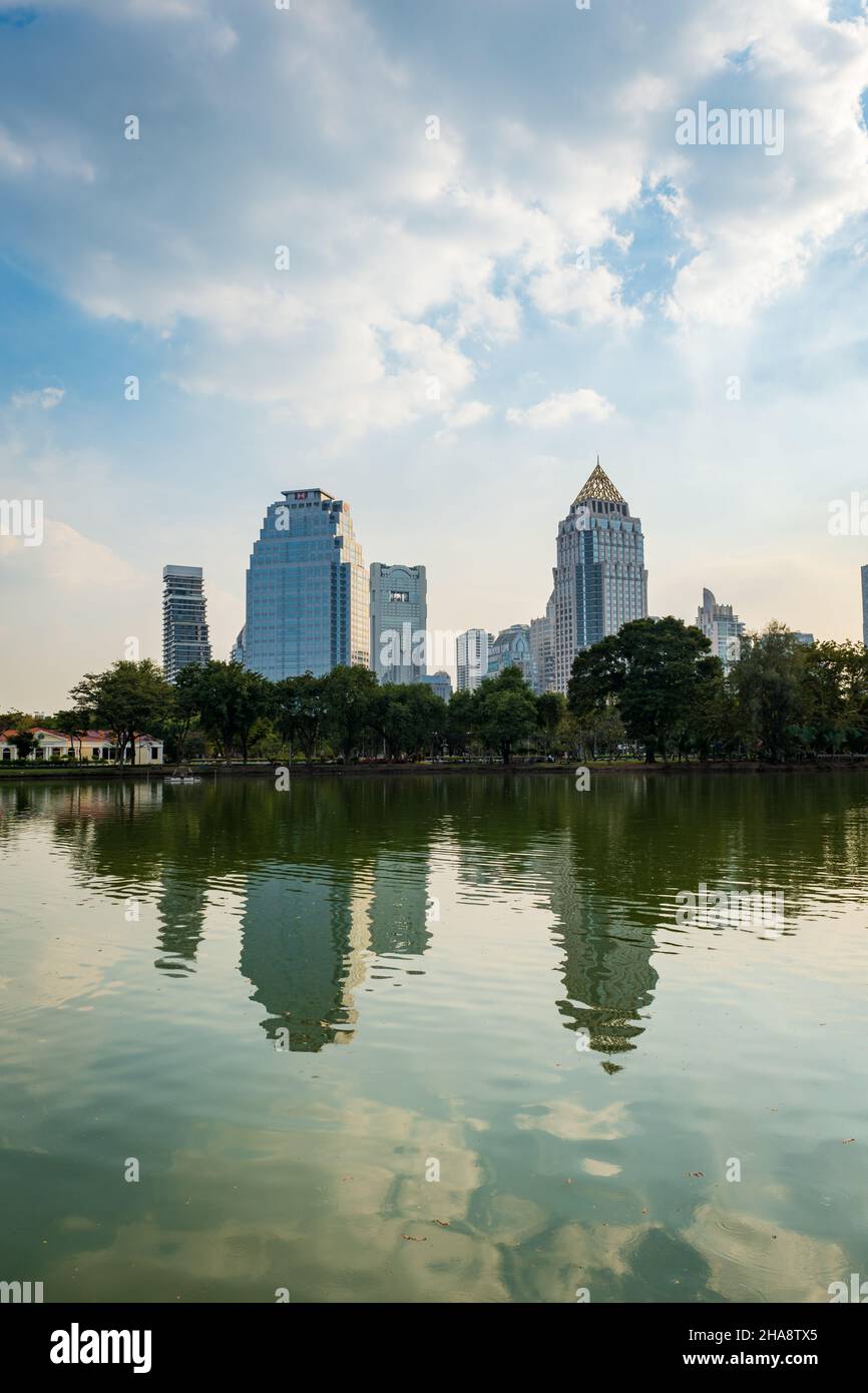 Lumpini park in Bangkok and the skyline of downtown Bangkok central ...