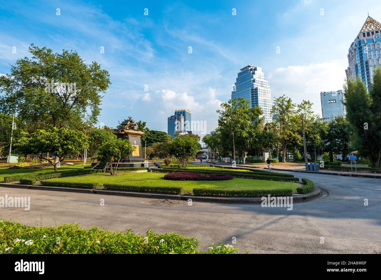 Lumpini park in Bangkok and the skyline of downtown Bangkok central ...