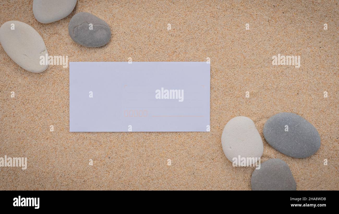 Background grains of sea sand, fine beach sand with envelope and pebble ...
