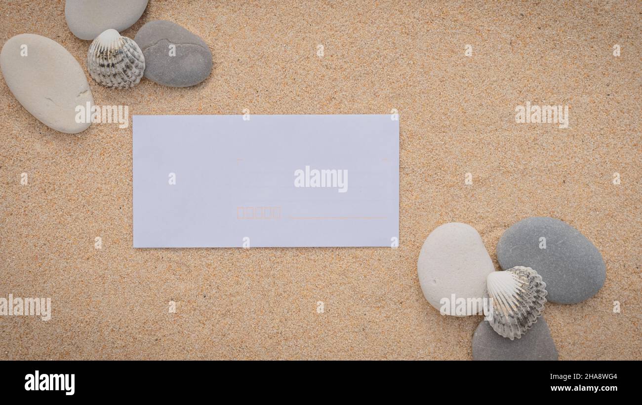 Background grains of sea sand, fine beach sand with envelope and pebble ...