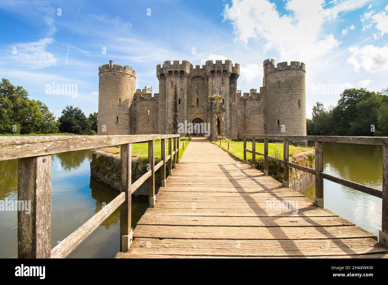view across bridge of 14th-century moated Bodiam castle near ...