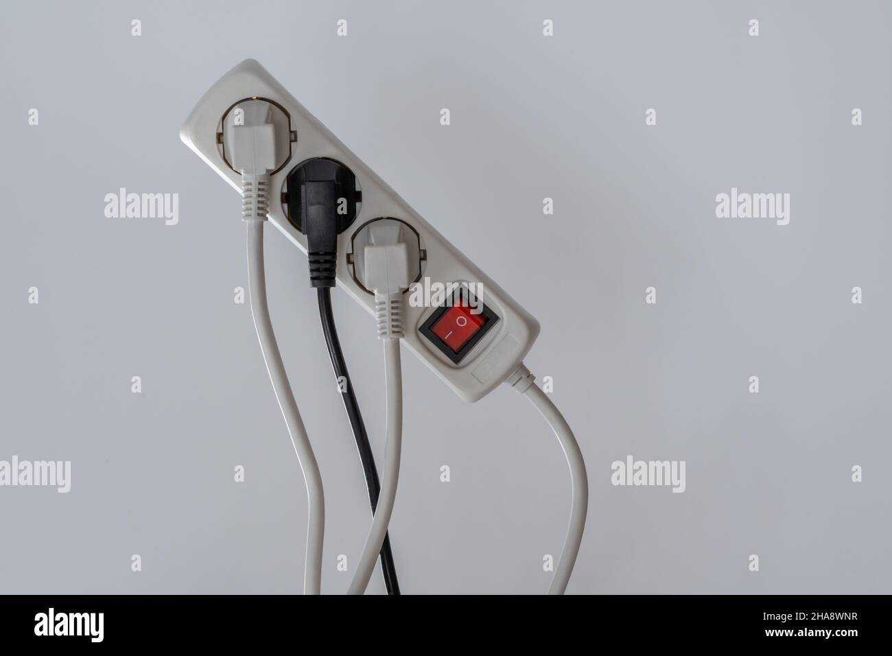 Wires plugged into power bar Stock Photo - Alamy