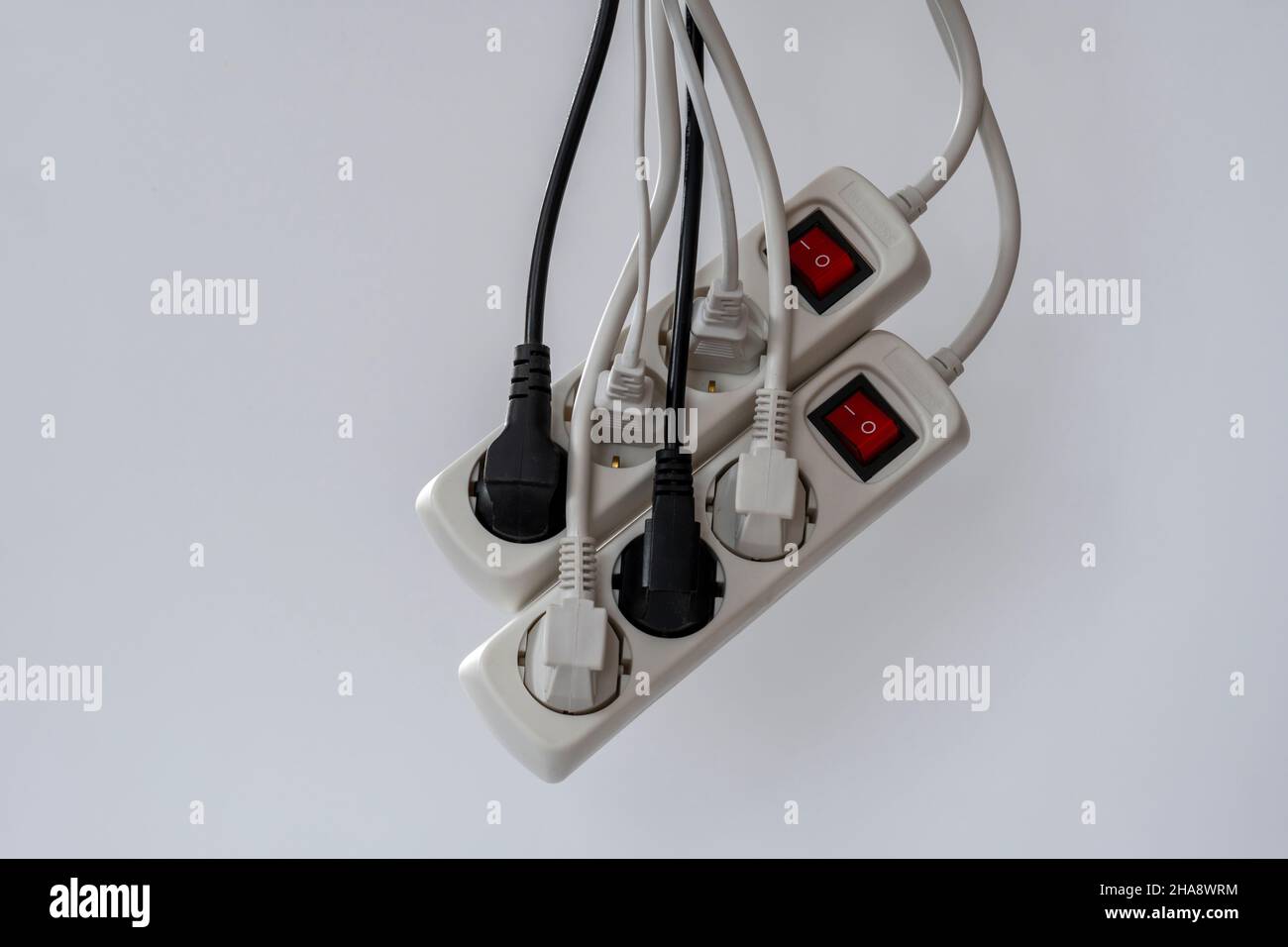 Wires plugged into power bar Stock Photo - Alamy