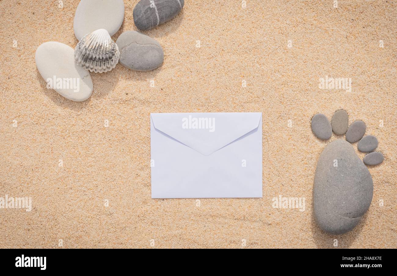 Background grains of sea sand, beach sand with envelope and pebble ...