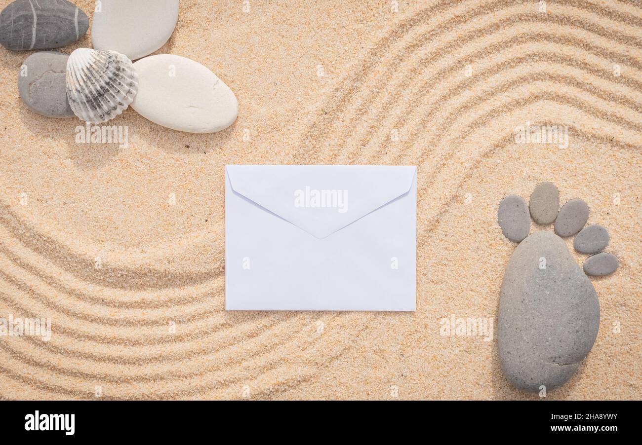 Background grains of sea sand, beach sand with envelope and pebble ...