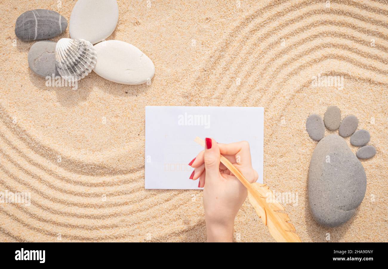 Background grains of sea sand, beach sand with envelope and pebble ...
