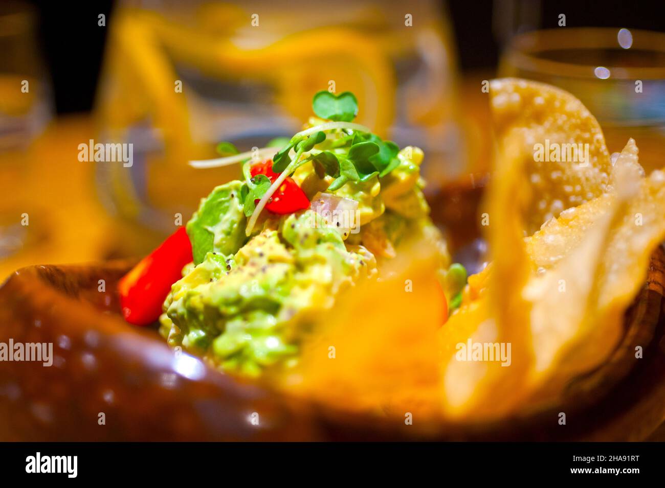 fresh avocado and shrimps salad with nachos on side Stock Photo - Alamy