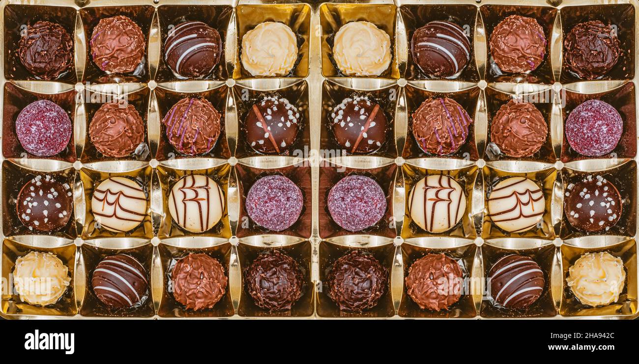 chocolate candies in the box, top view Stock Photo - Alamy