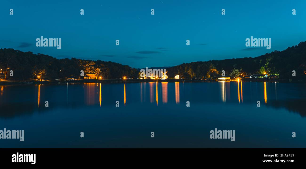 Landscape panorama with windmills at the blue hour Stock Photo - Alamy