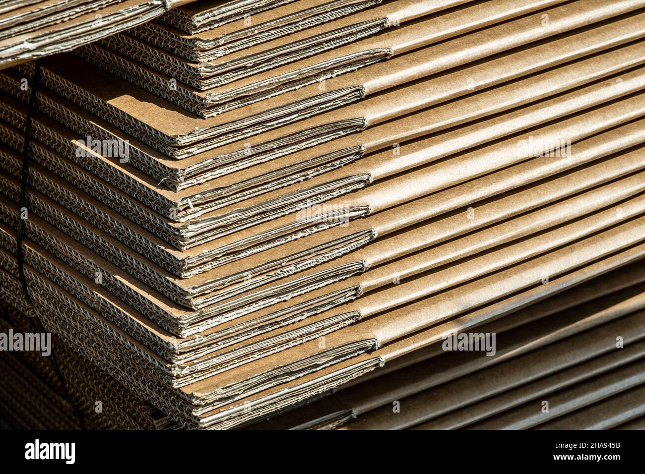 Stacking used cardboard box for recycling Stock Photo - Alamy