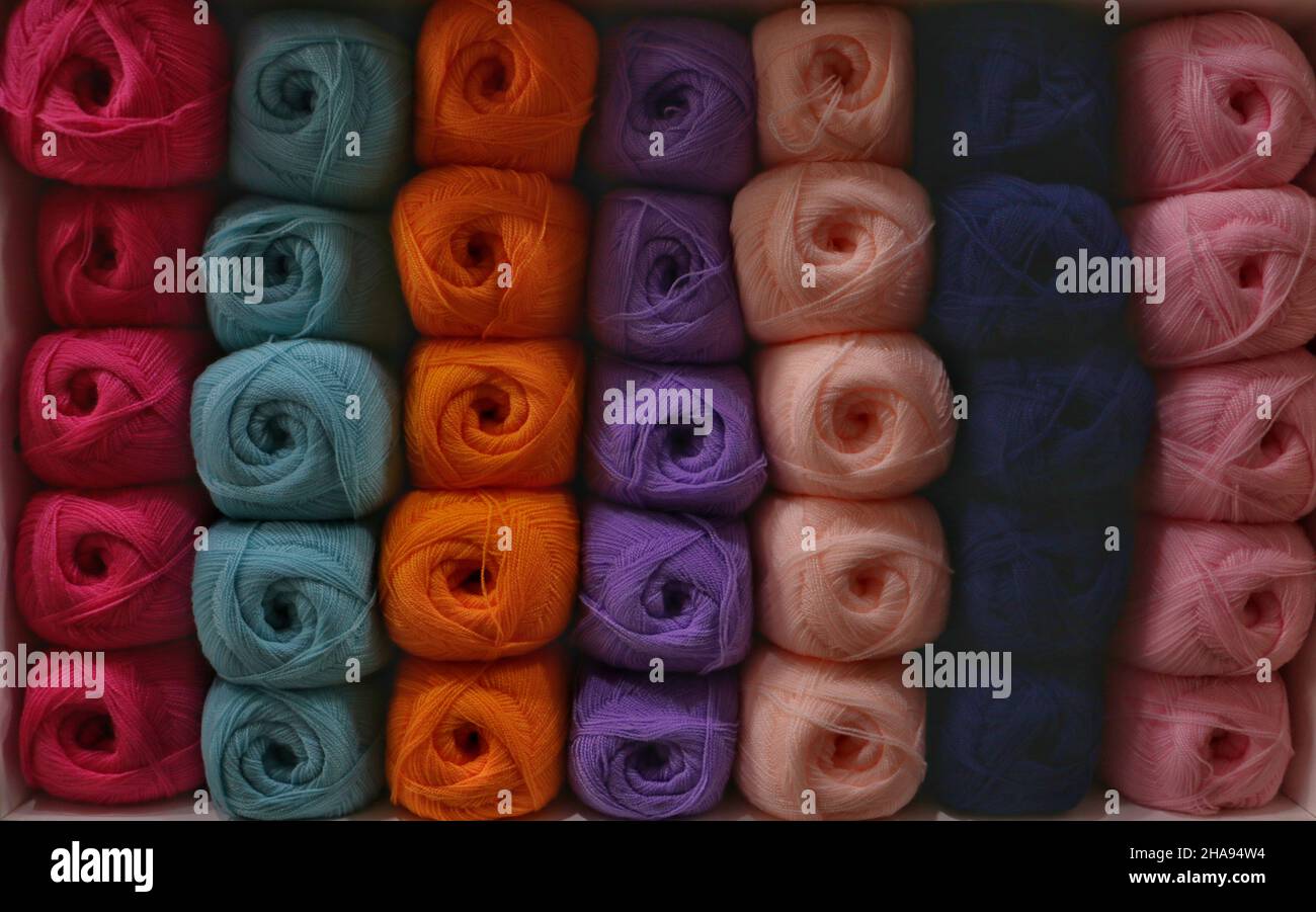 Colorful knitting yarns, yarns lined up on the shelf. Shopping concept ...