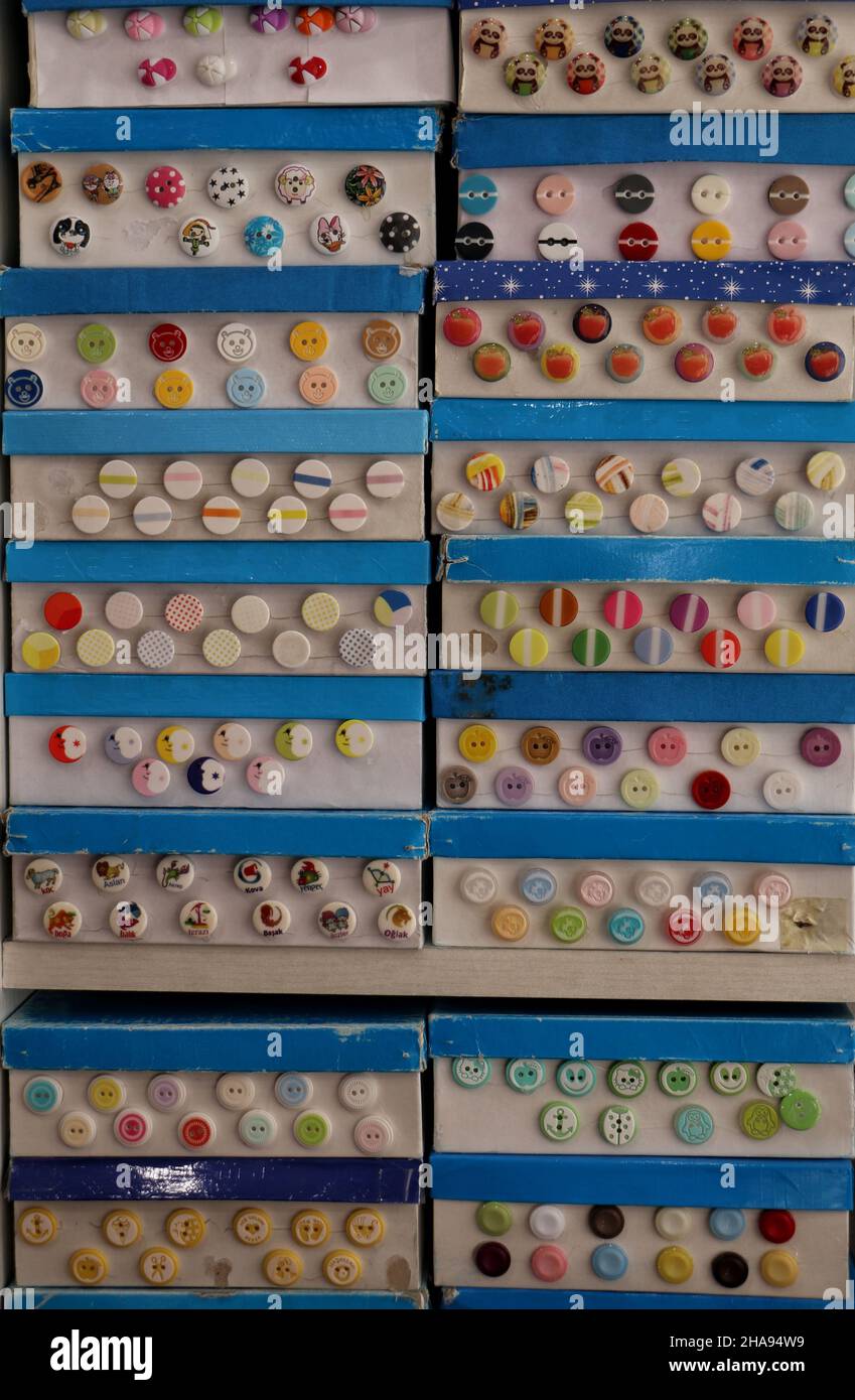 Button boxes in the haberdashery shop. There are colorful buttons on ...
