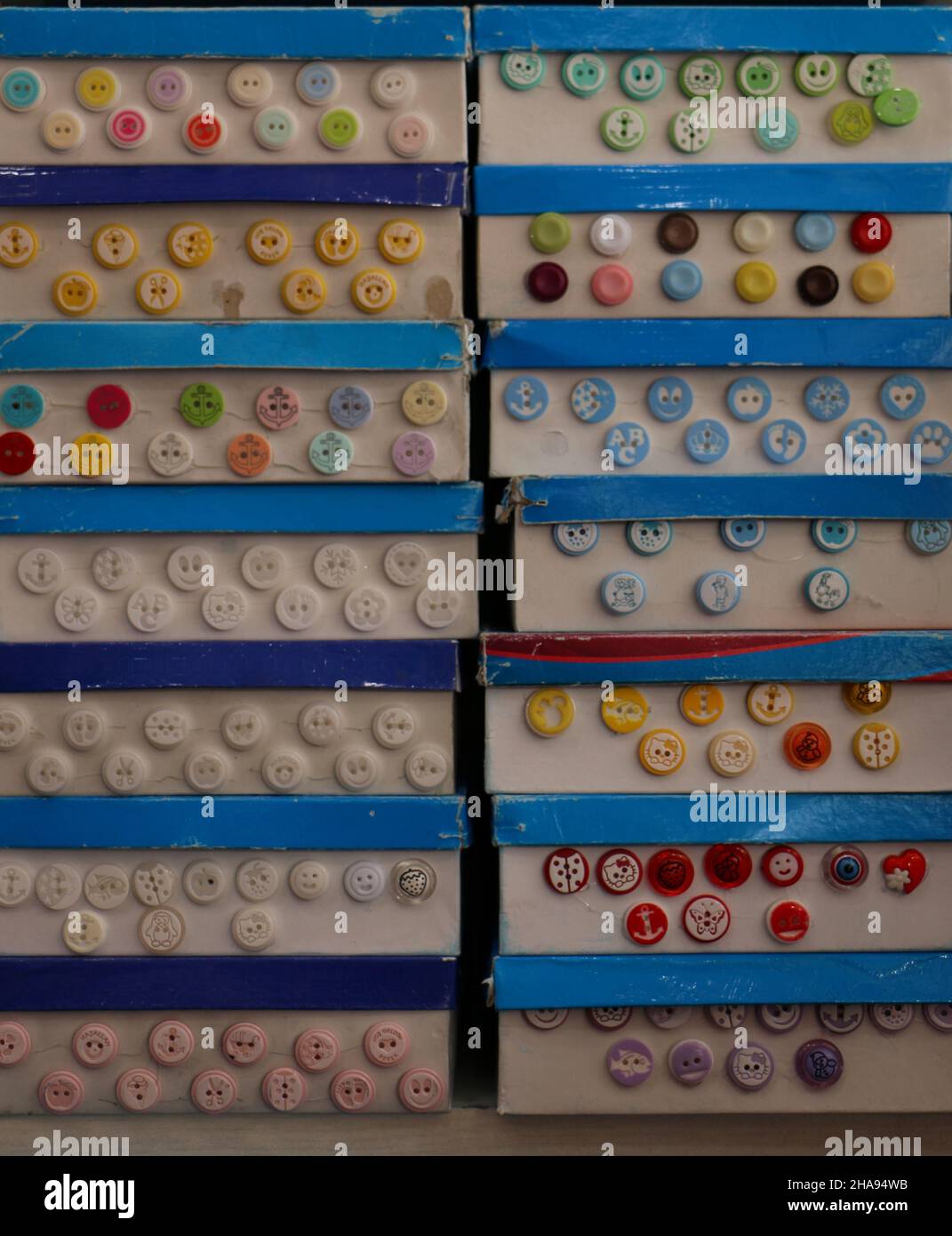 Button boxes in the haberdashery shop. There are colorful buttons on ...