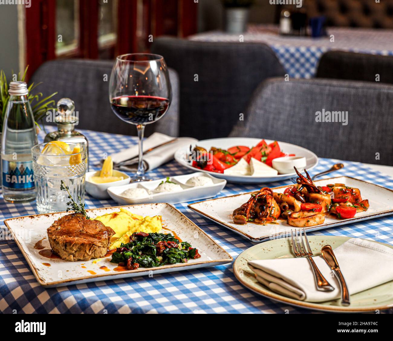 Assorted food set on a table in the restaurant Stock Photo - Alamy