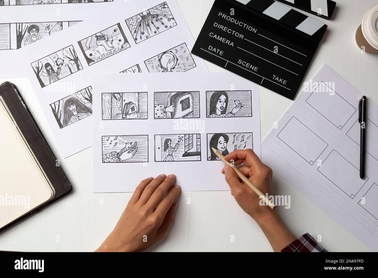 The artist draws a storyboard for the film. The director creates the ...