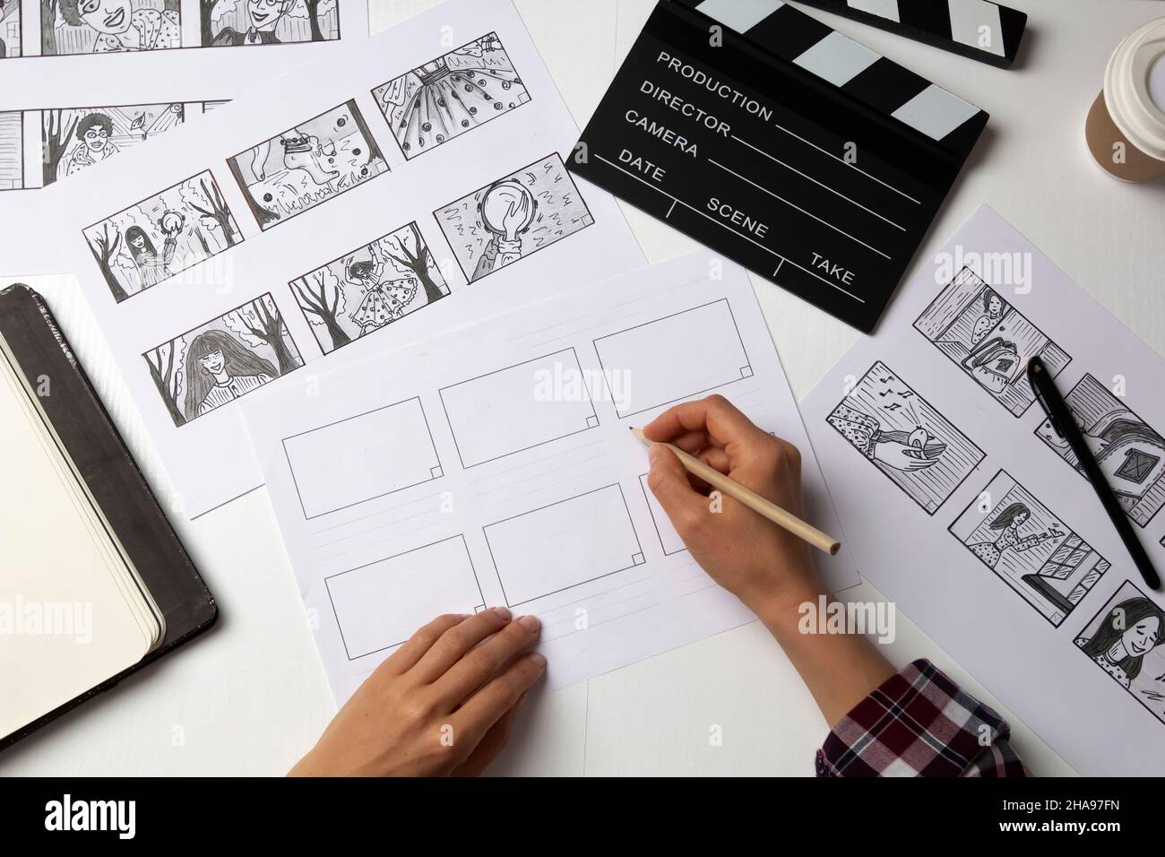 The artist draws a storyboard for the film. The director creates the ...