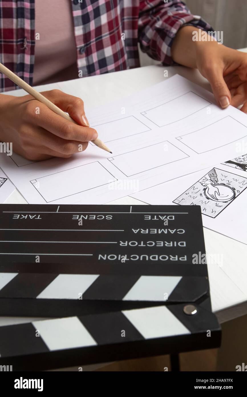 The artist draws a storyboard for the film. The director creates the ...