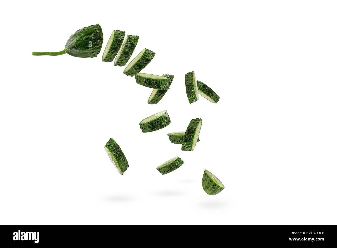 Falling cucumber slices on white isolated background. The cucumber ...