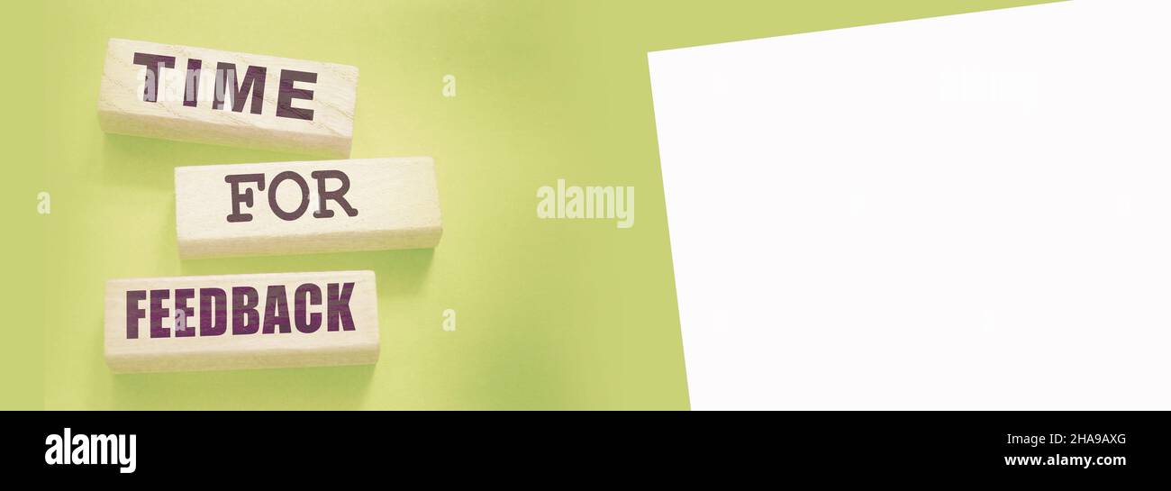 Time fir feedback text on wooden blocks. Product or service evaluation ...