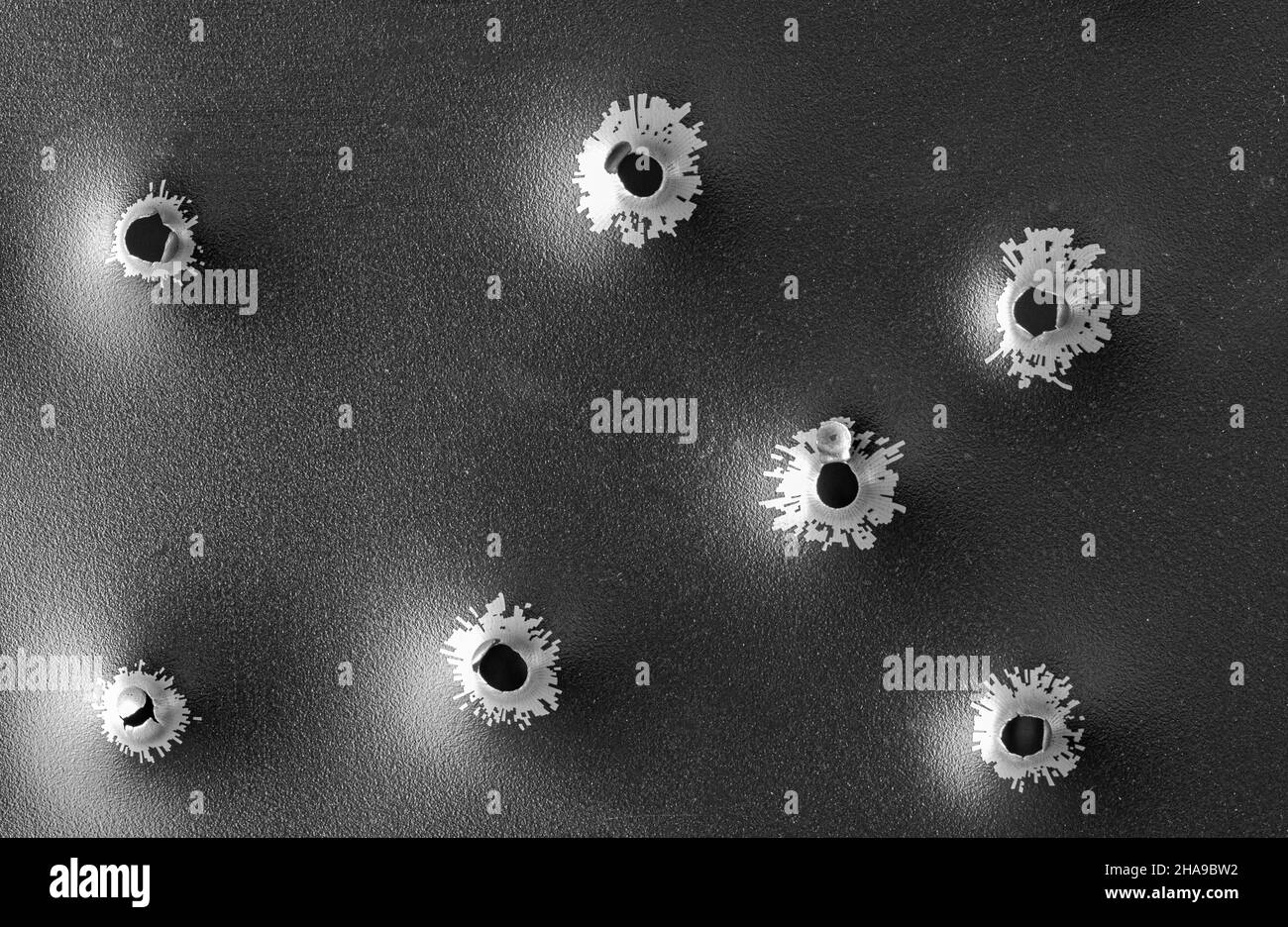 Bullet holes in metal. Concept, use of firearms. Close-up, selective ...
