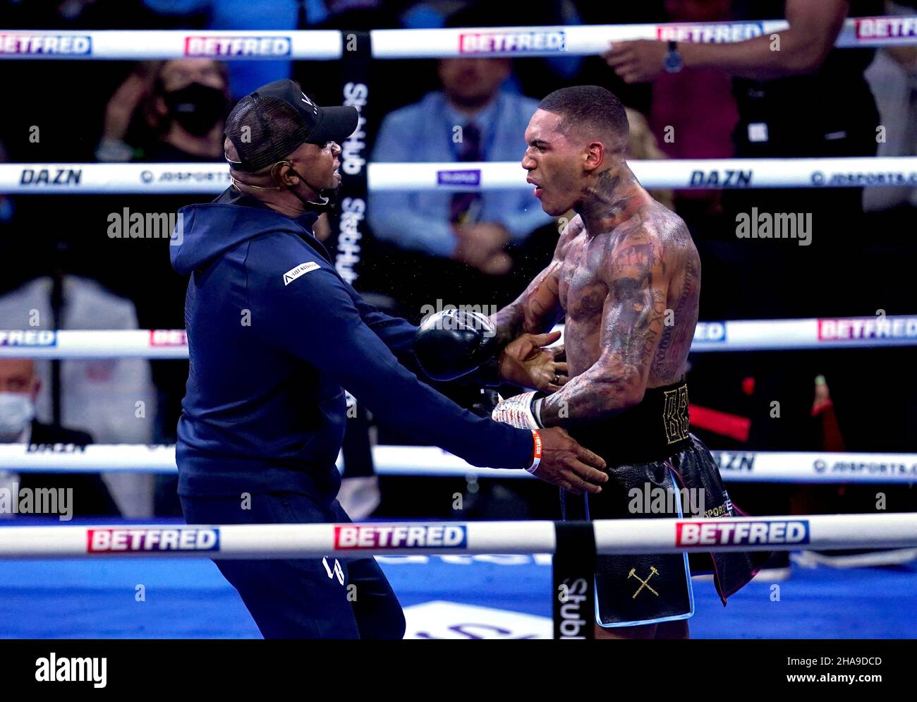 Nigel Benn (left) celebrates with son Conor Benn after he knocks out ...