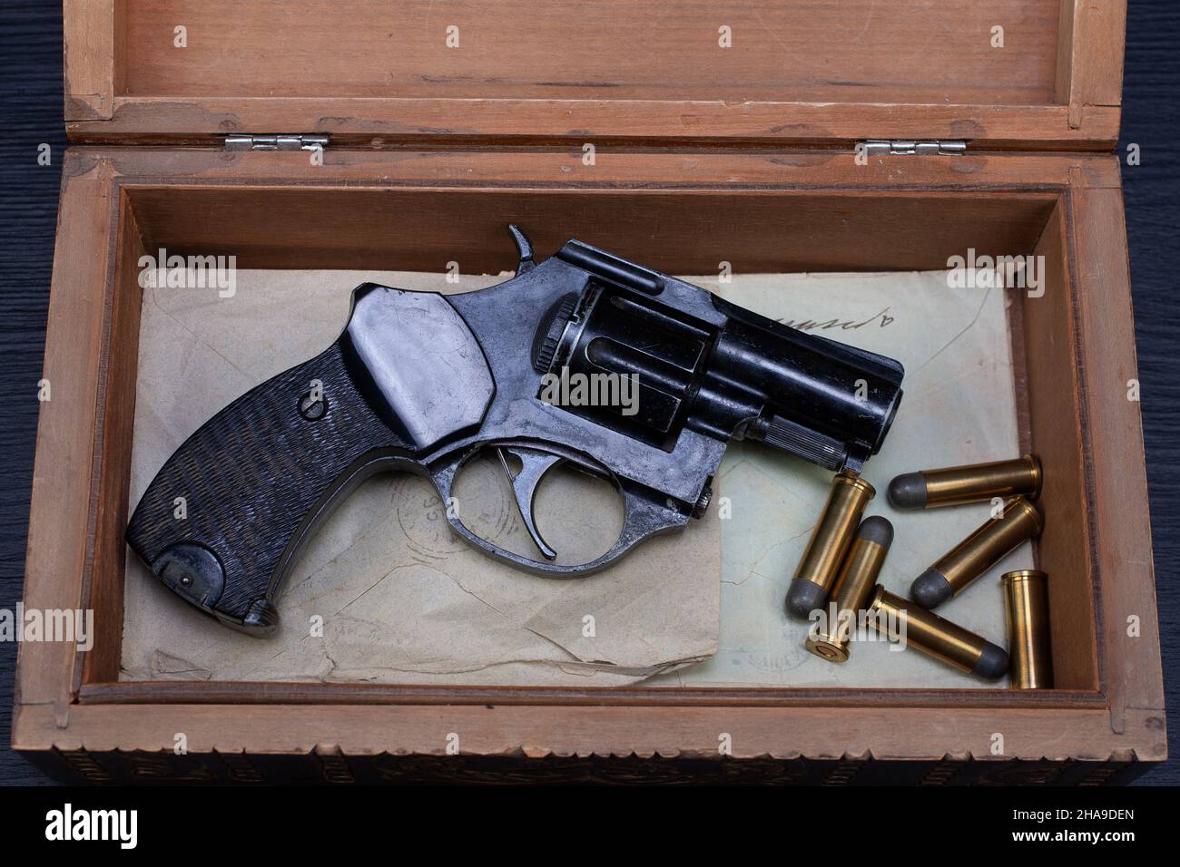 vintage revolver gun with ammunition in wooden box for letters Stock ...