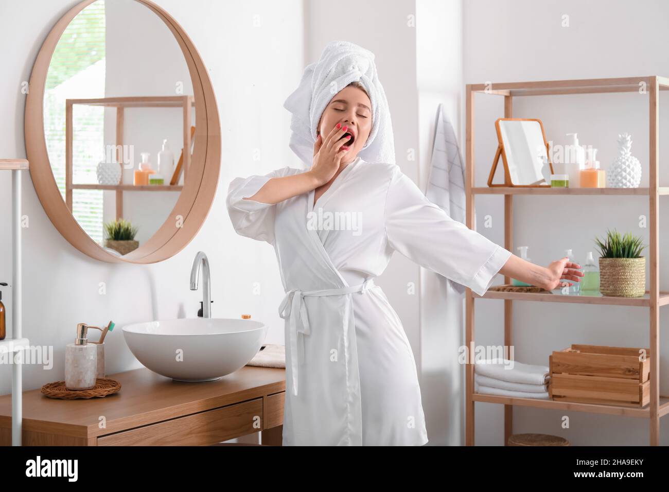 Pretty young woman stretching in bathroom after morning shower Stock ...
