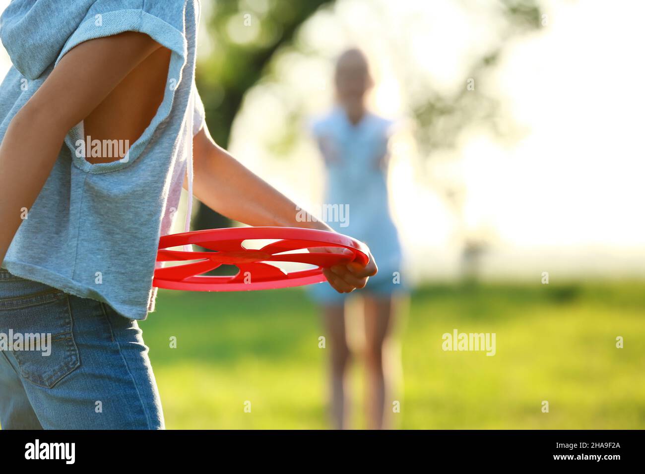 Cute little children playing frisbee outdoors Stock Photo - Alamy