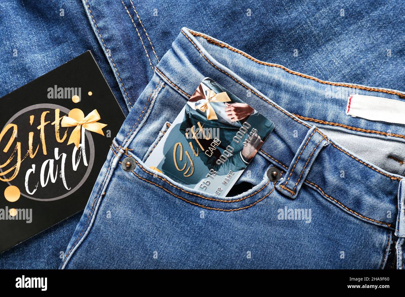 Gift card in jeans pocket, closeup Stock Photo - Alamy