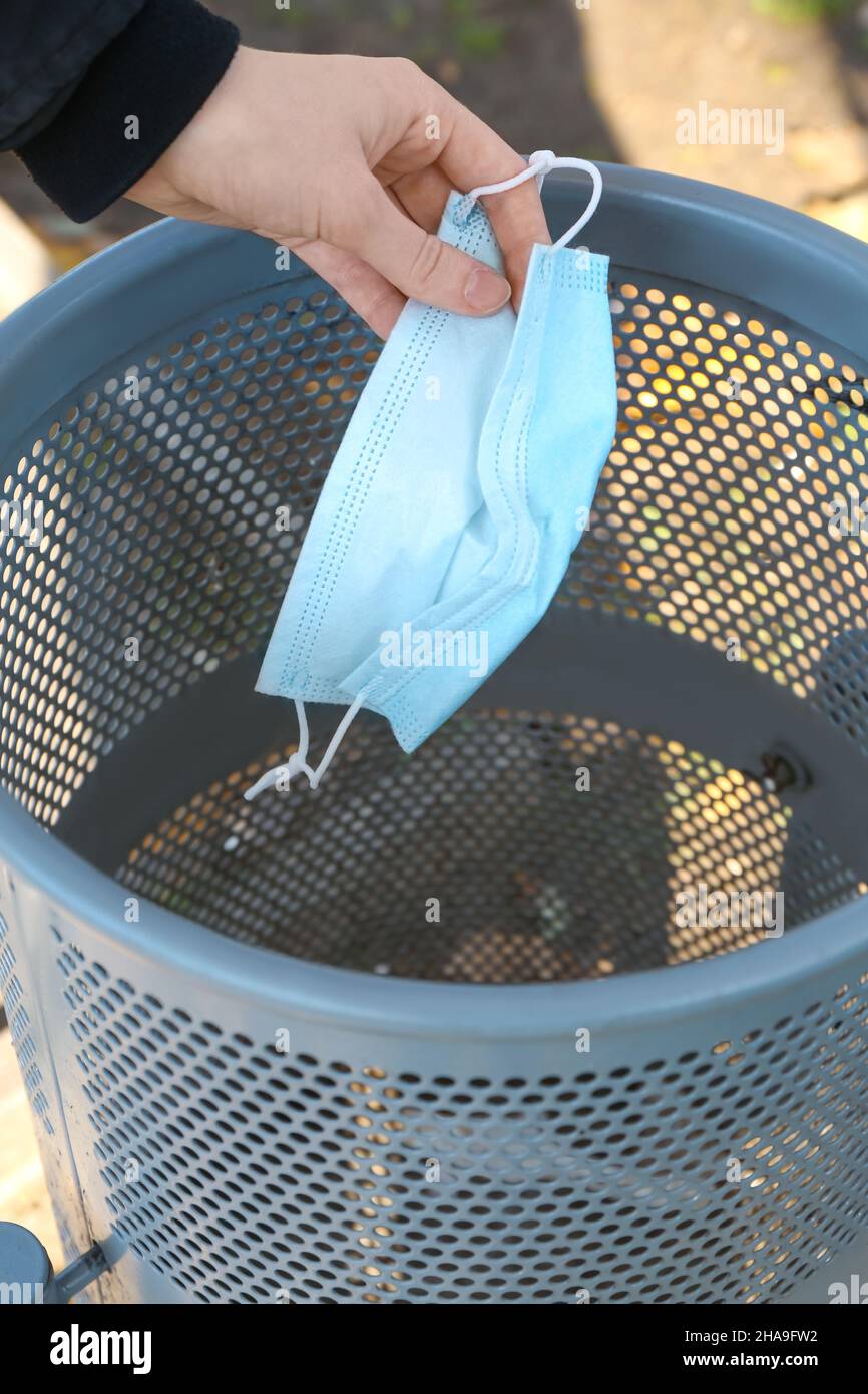 Hand throwing garbage dust bin hi-res stock photography and images - Alamy