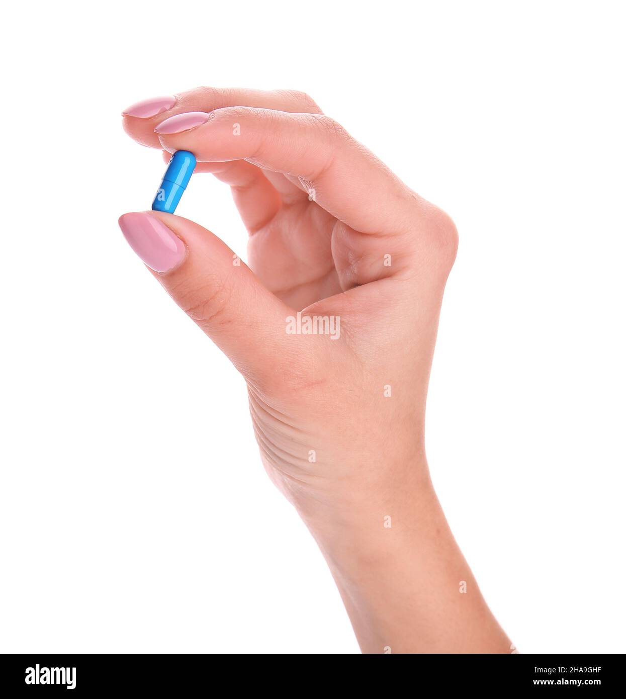 Hand with blue pill isolated on white Stock Photo - Alamy