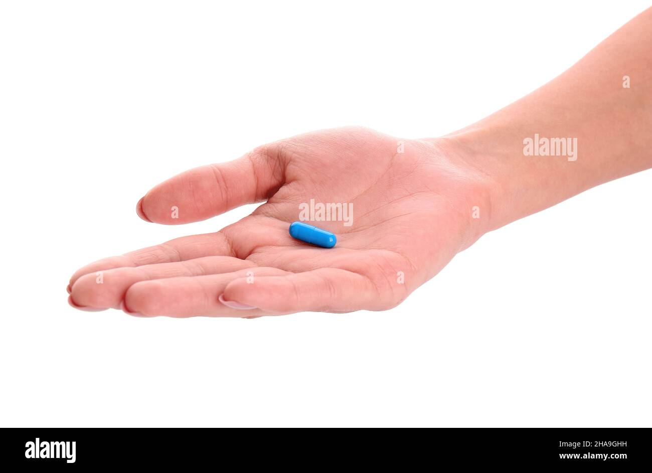 Hand with blue pill isolated on white Stock Photo - Alamy