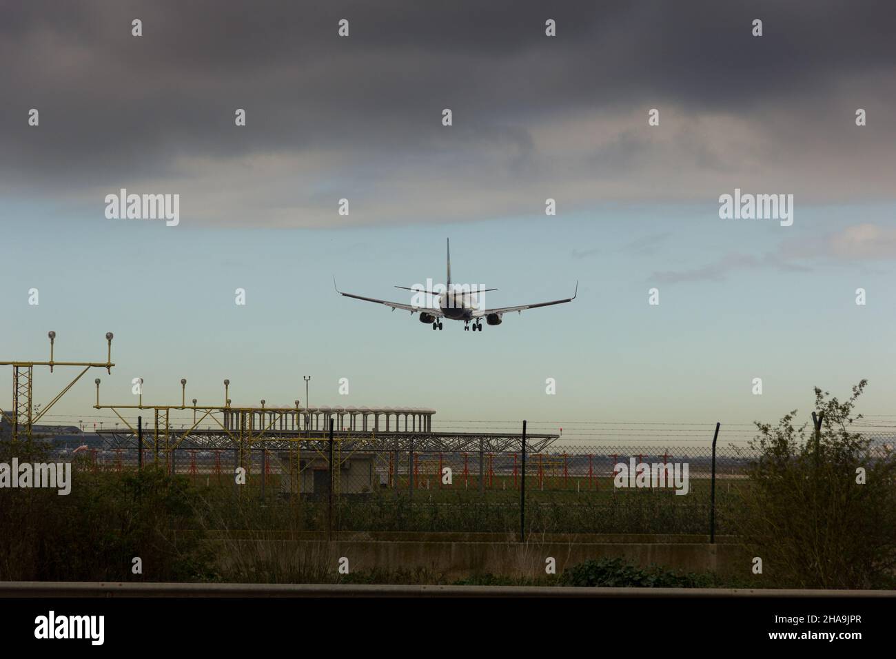 Passenger aircraft on approach to the airport for landing Stock Photo ...