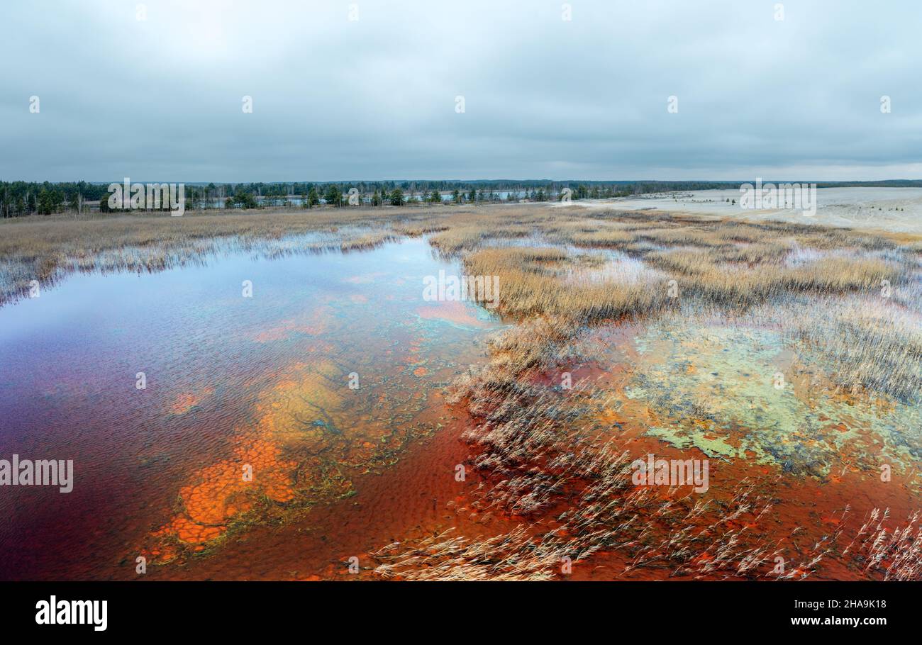 Mining of ores of various metals. Red toxic water in the reservoir of ...