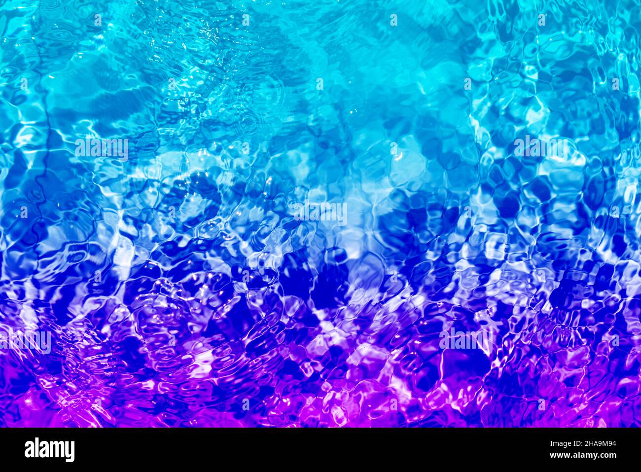 Rippled water surface with many drops. Caustics on the surface of the ...