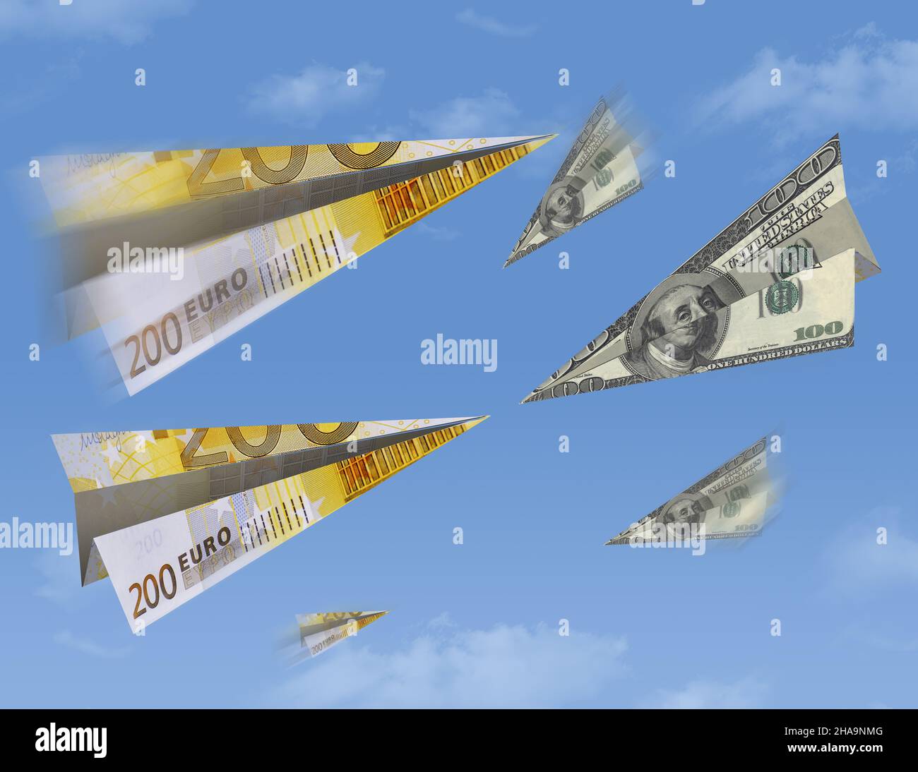 Paper airplanes made of a 200 Euro notes fly past planes made of a US ...
