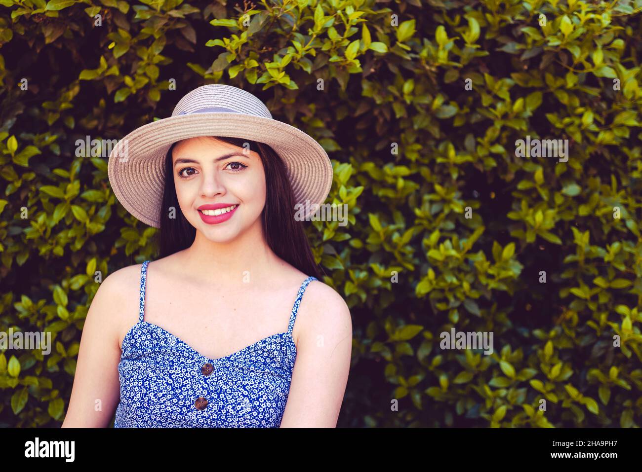 Young woman portrait using a hat at park at spring summer season Stock ...