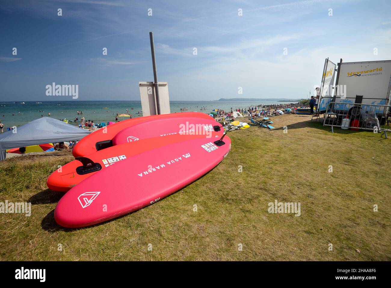Stand Up Paddling SUP boards and beach hut at Clonea Strand, Waterford ...