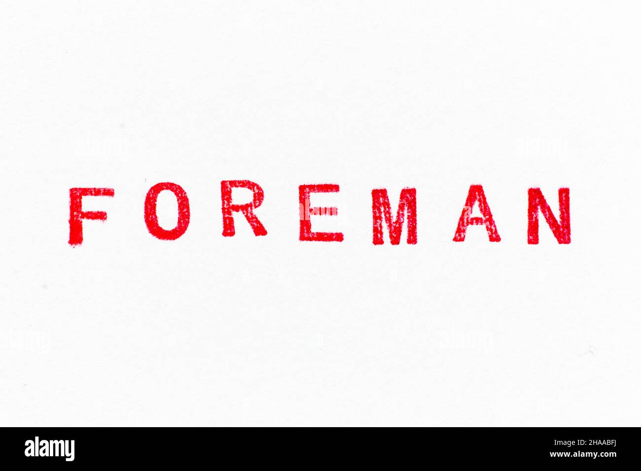 Red color ink rubber stamp in word foreman on white paper background ...