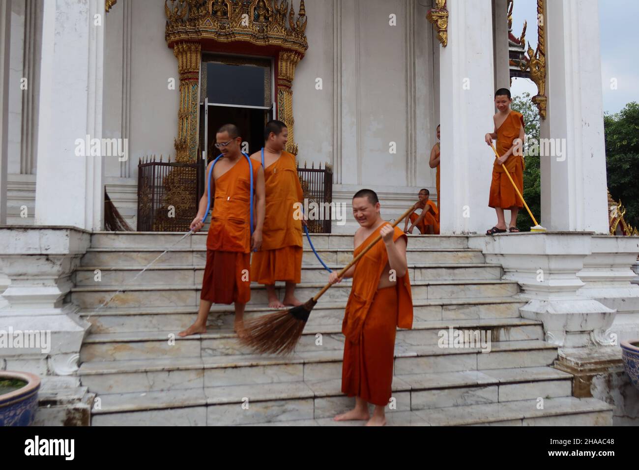 Smiling Young novice Buddhist monks cleaning temple, Bangkok,Thailand ...