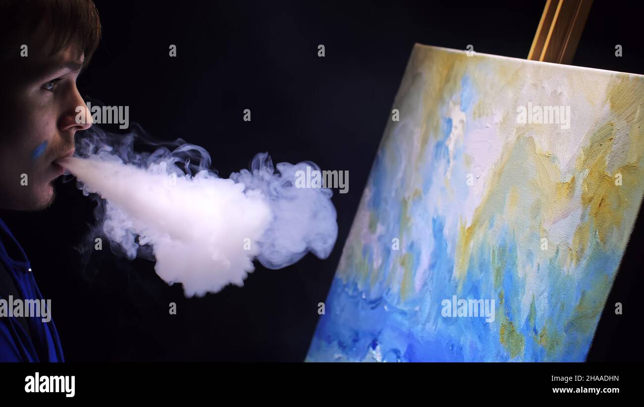 Artist copyist paint seascape with ship in ocean. Vaper smoke vape e ...