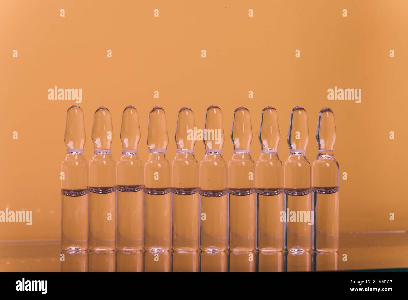 Glass medical ampoule vial for injection. Medicine is liquid sodium ...