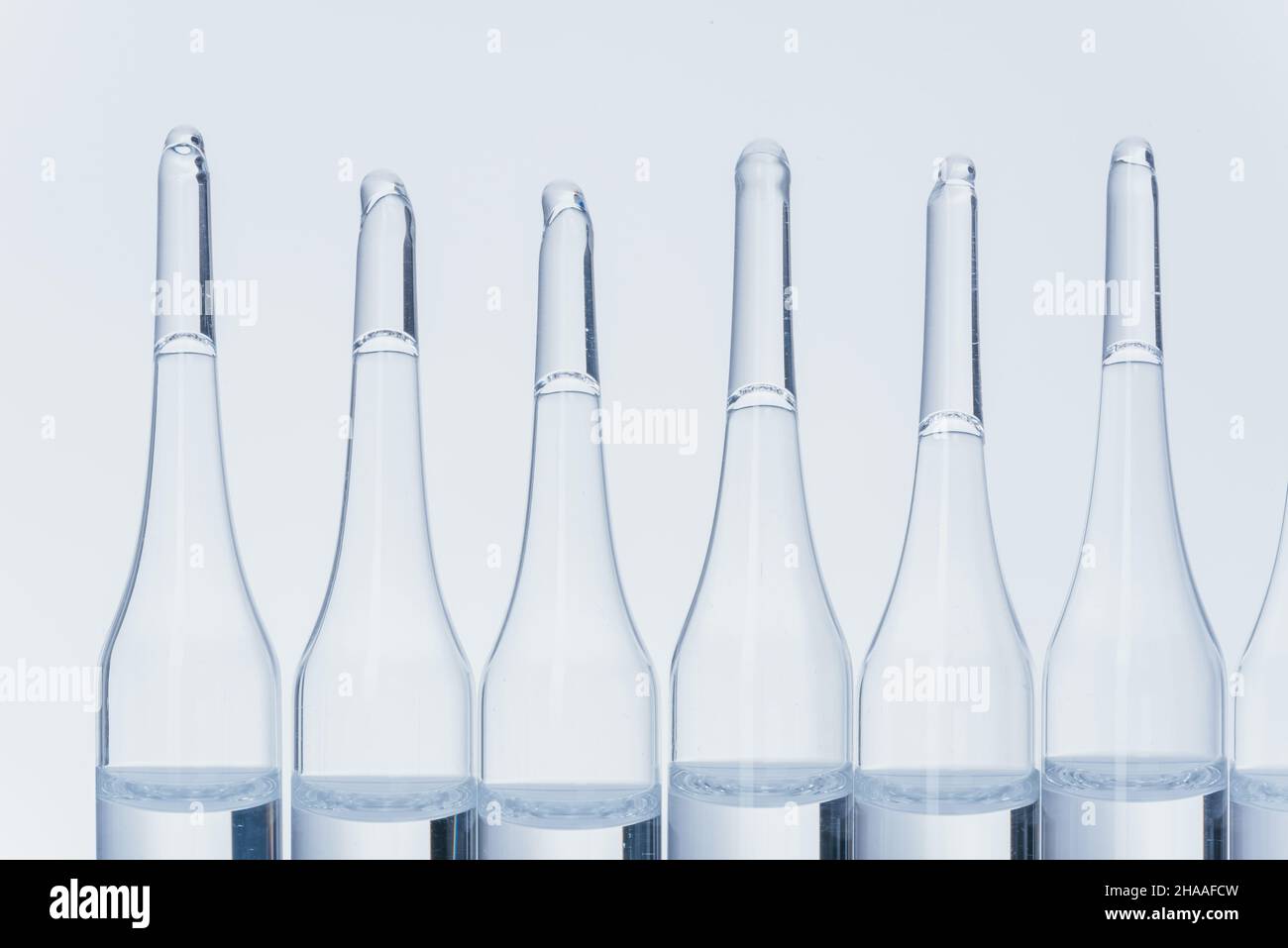 Glass medical ampoule vial for injection. Medicine is dry white drug ...