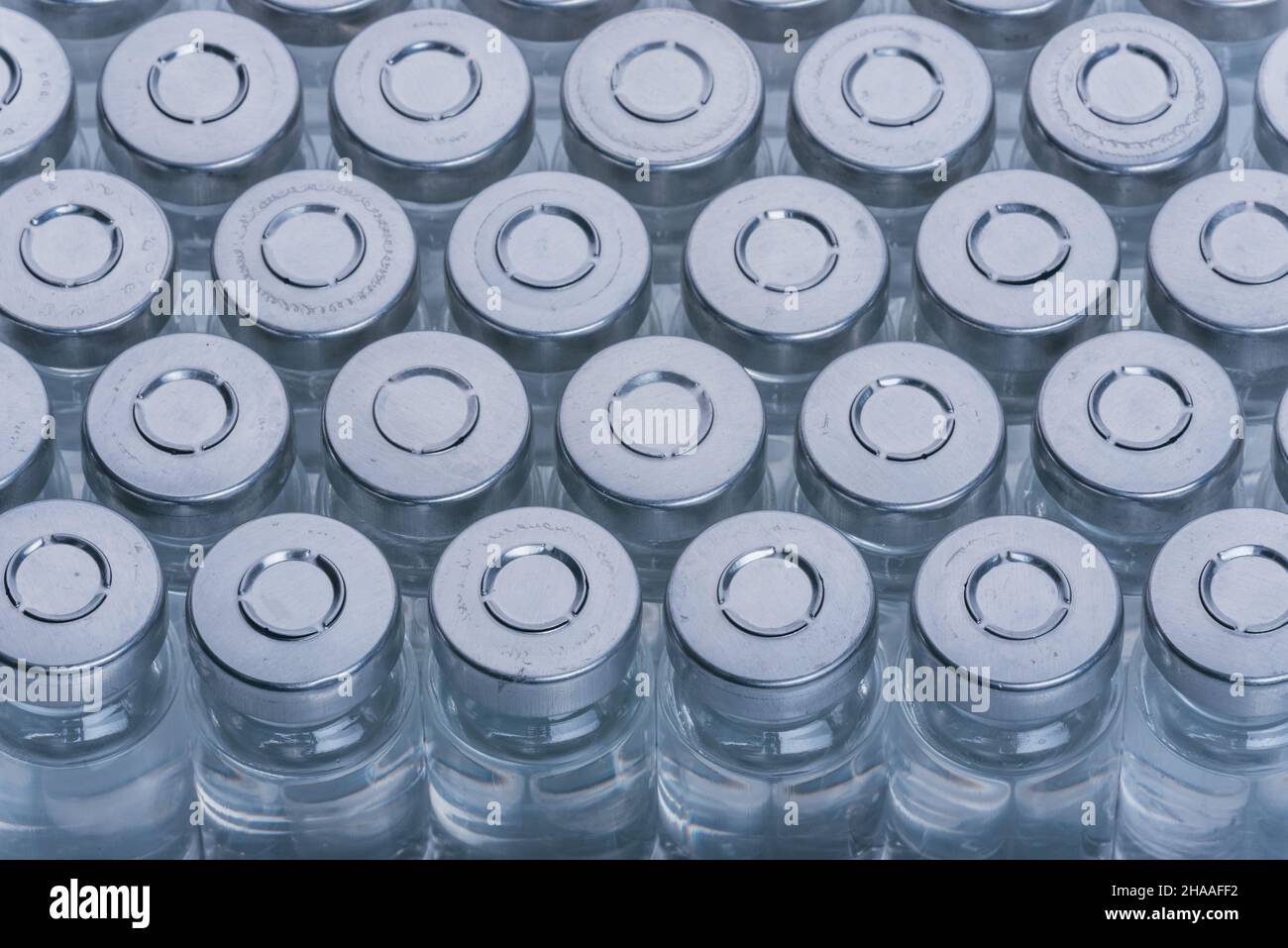 Glass medical ampoule vial for injection. Medicine is dry white drug ...