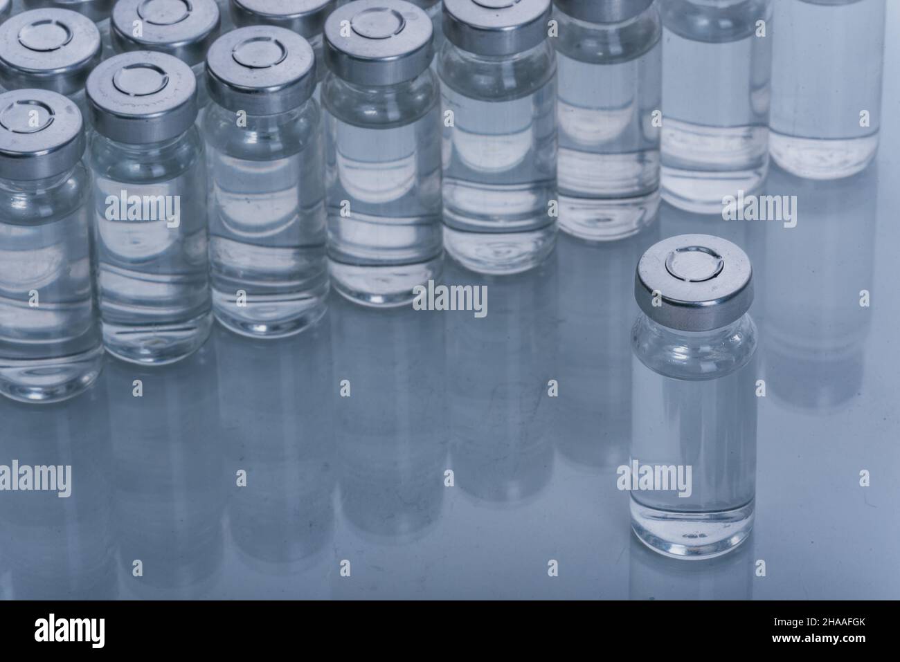 Glass medical ampoule vial for injection. Medicine is dry white drug ...